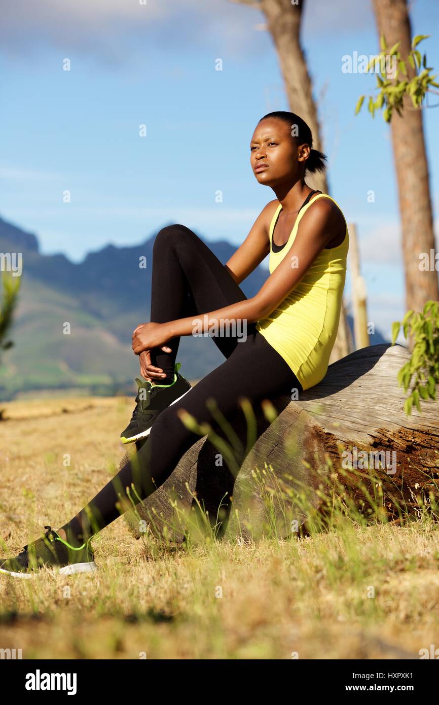 Portrait of young fitness woman relaxing after workout Stock Photo - Alamy