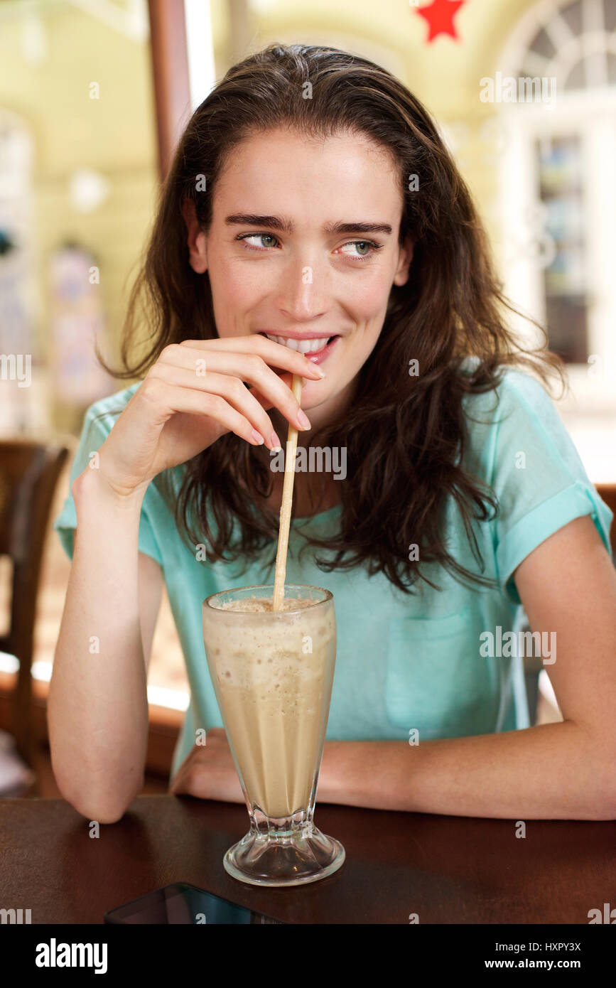 Woman sipping milkshake hi-res stock photography and images - Alamy