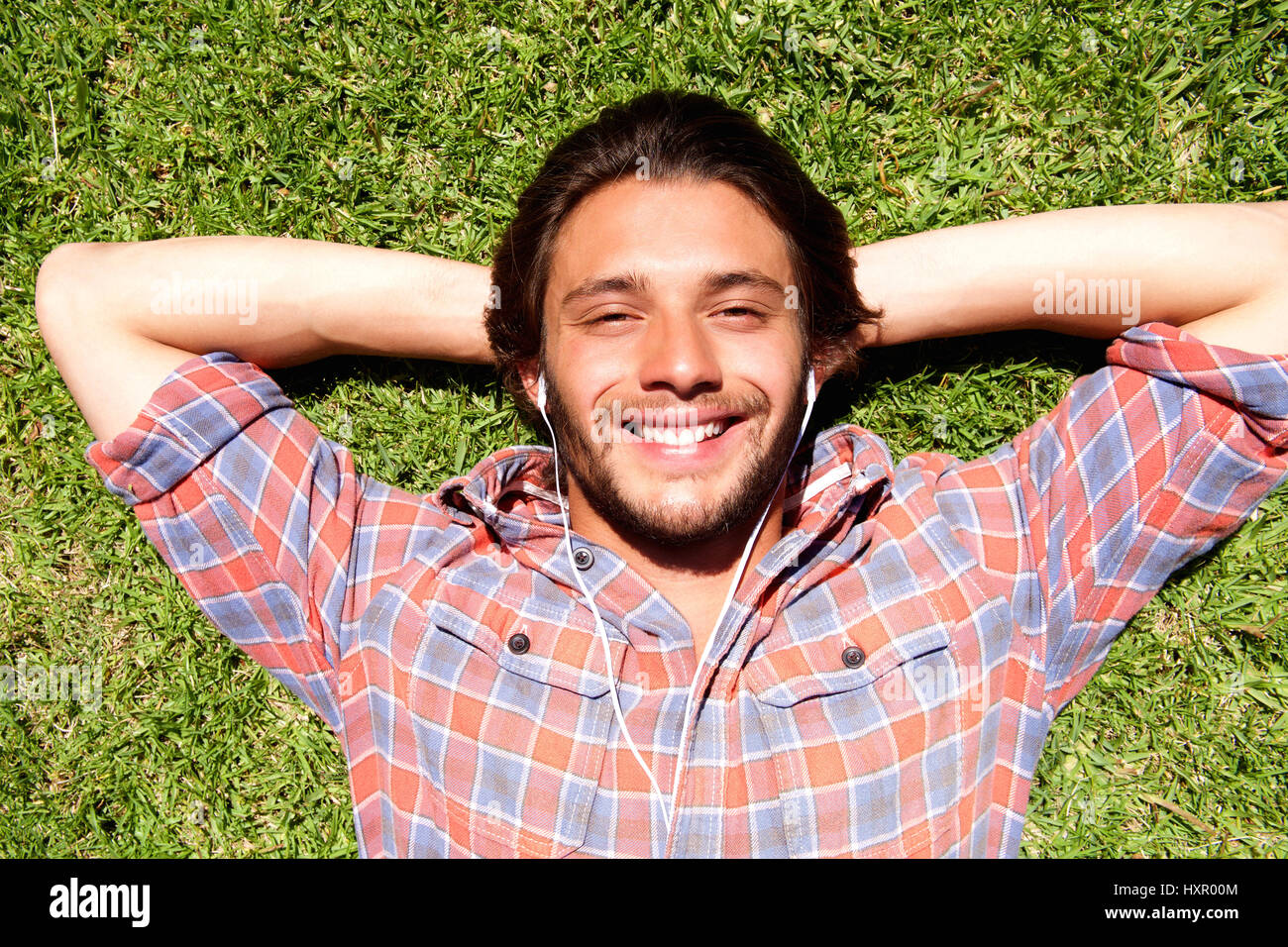 Man lying in grass hi-res stock photography and images - Alamy