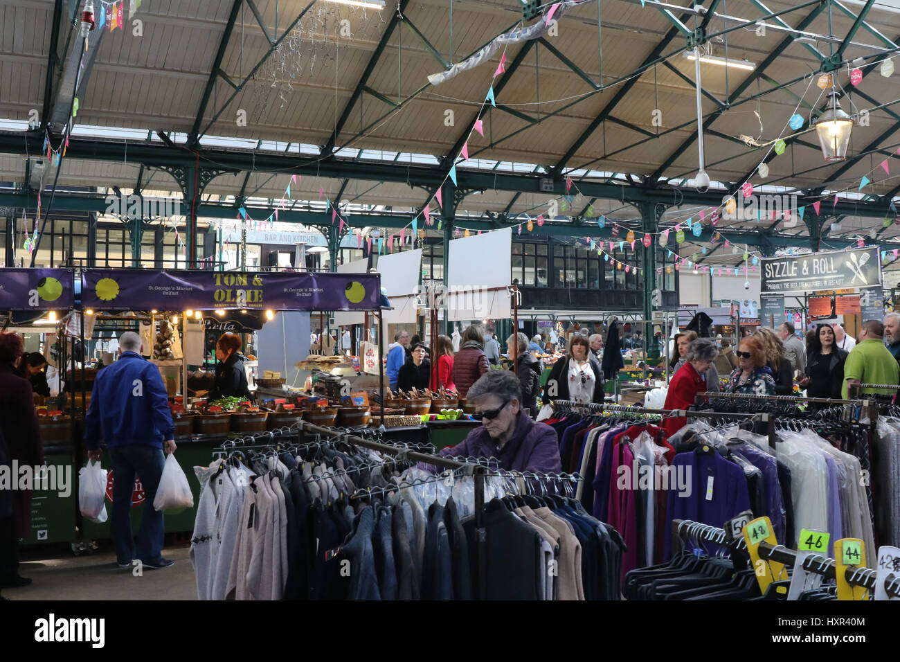 Stalls and people in St George' Market in Belfast, Northern Ireland ...