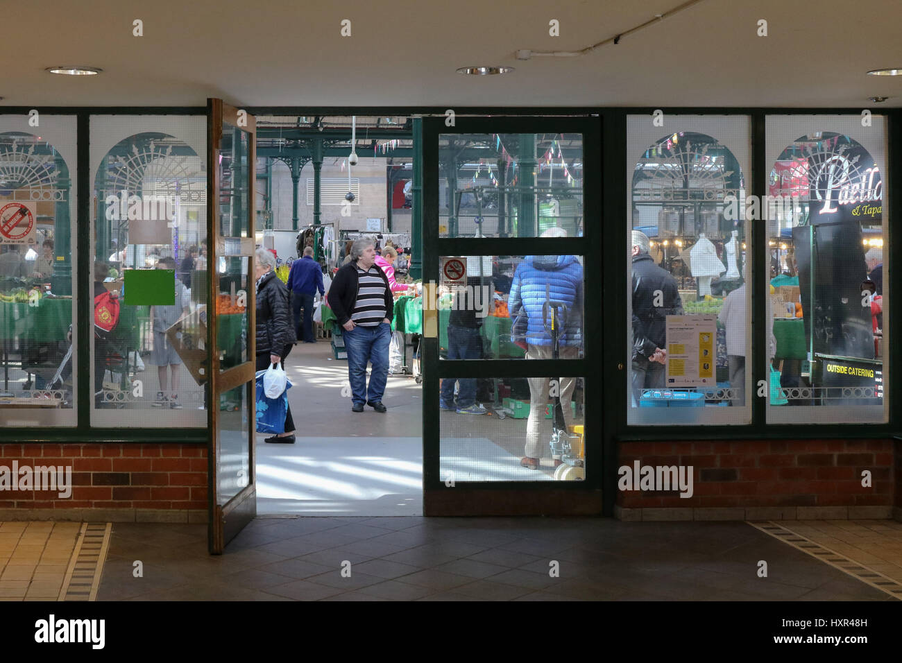 Stalls and people in St George' Market in Belfast, Northern Ireland ...