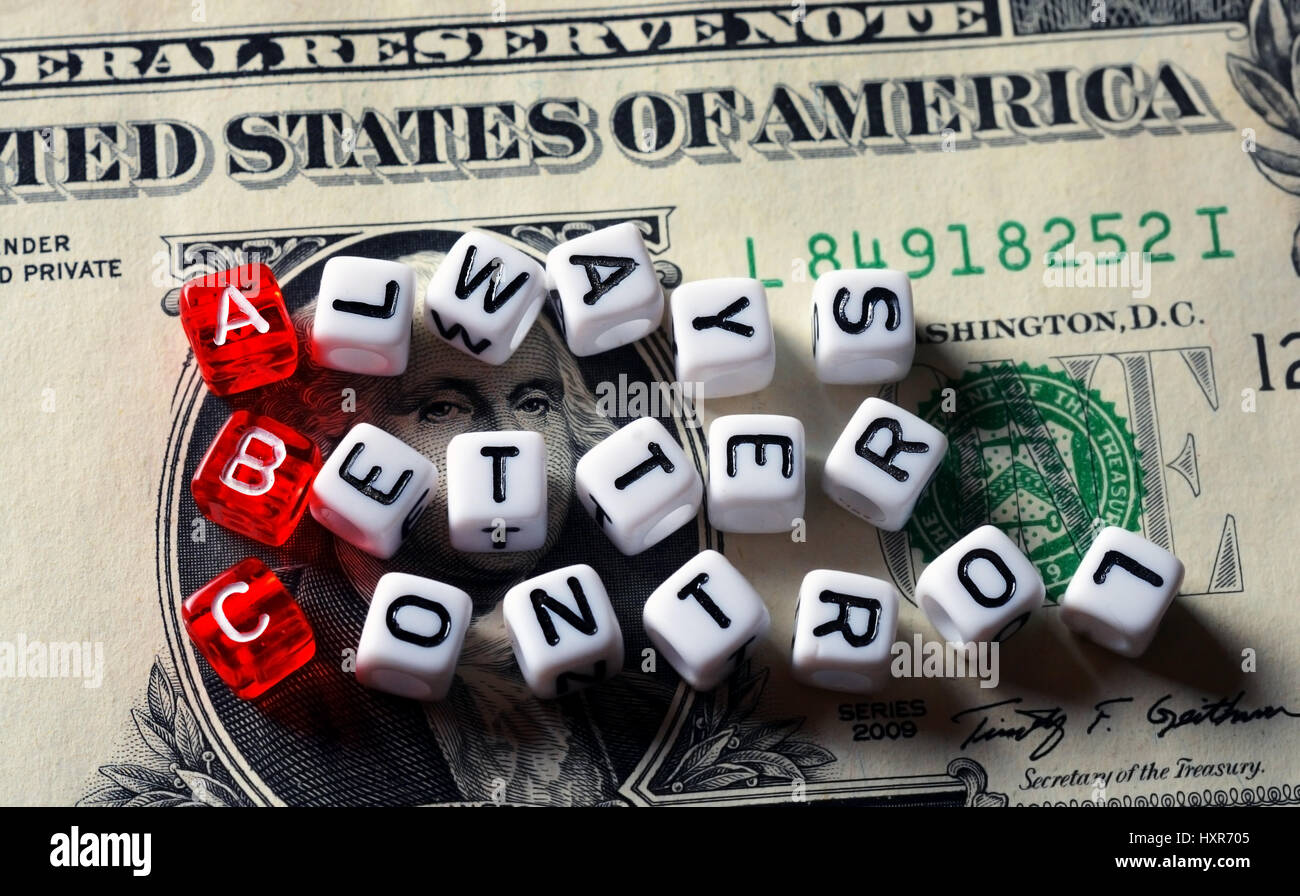 ABC - Always Better Control acronym dices on dollar bill Stock Photo ...