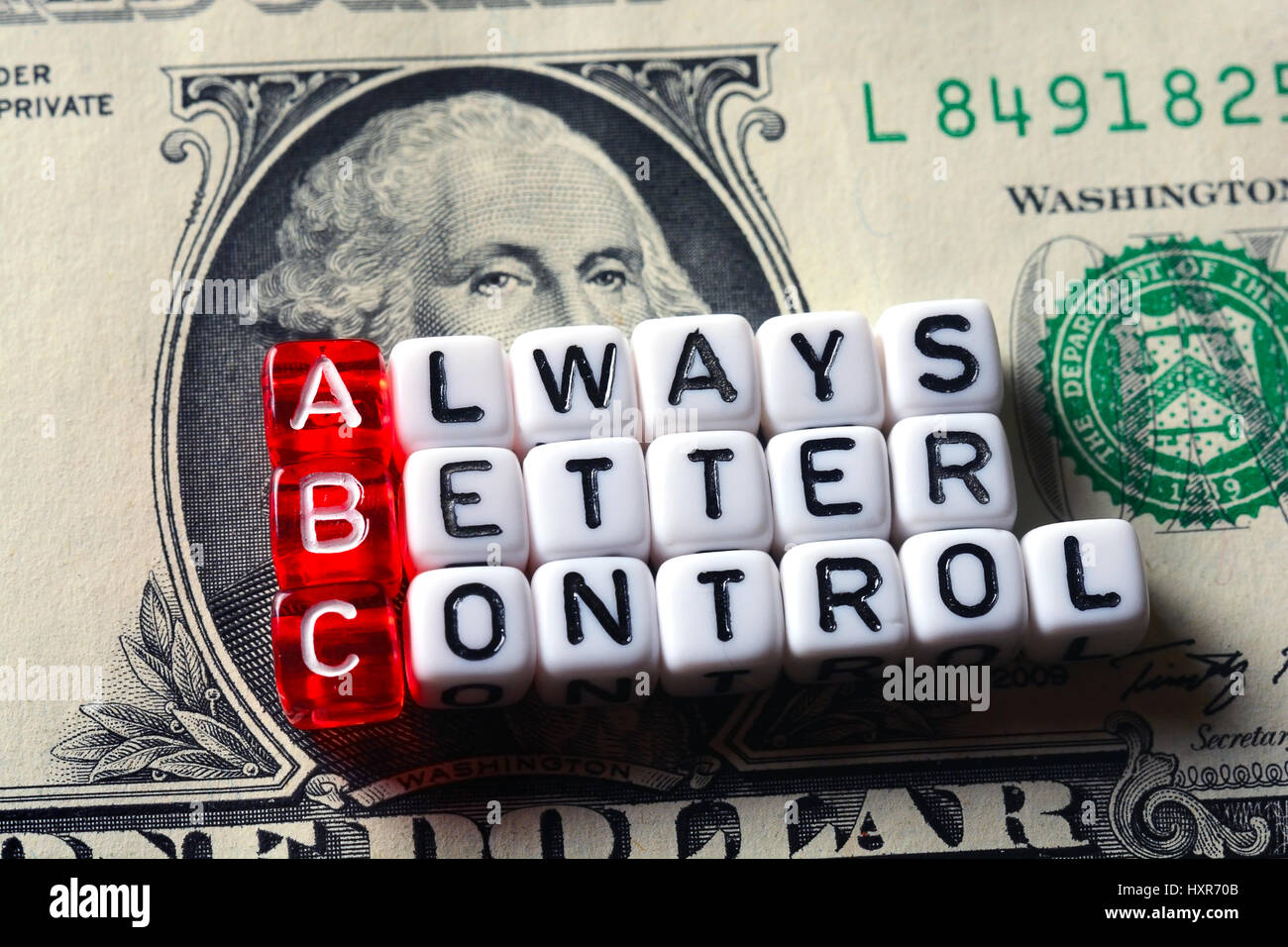 ABC - Always Better Control acronym dices on dollar bill Stock Photo ...