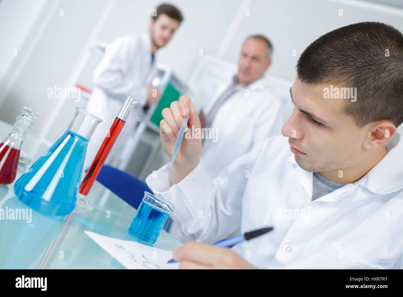 Student performing science experiment Stock Photo - Alamy