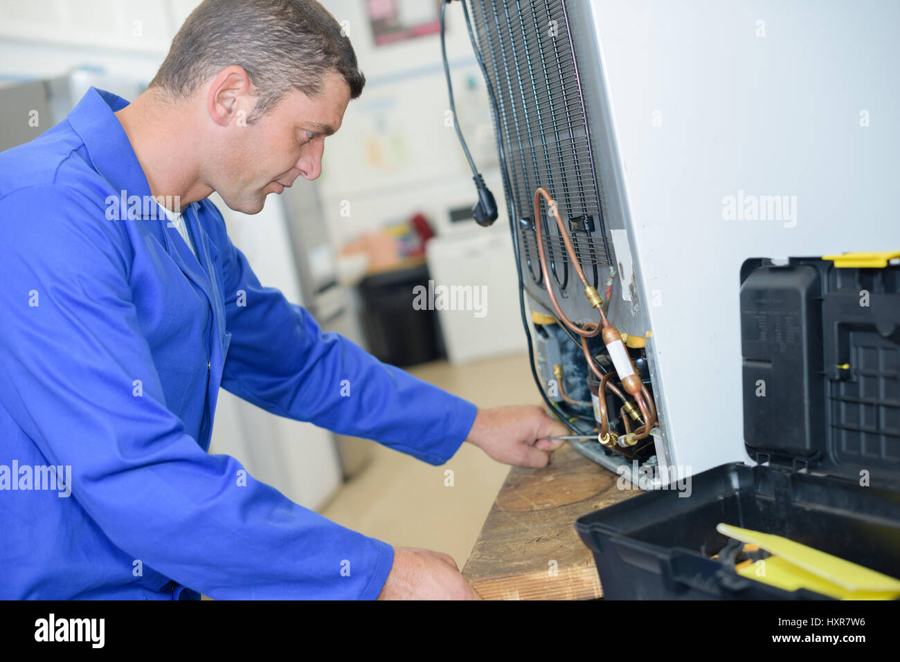 fixing an appliance Stock Photo - Alamy