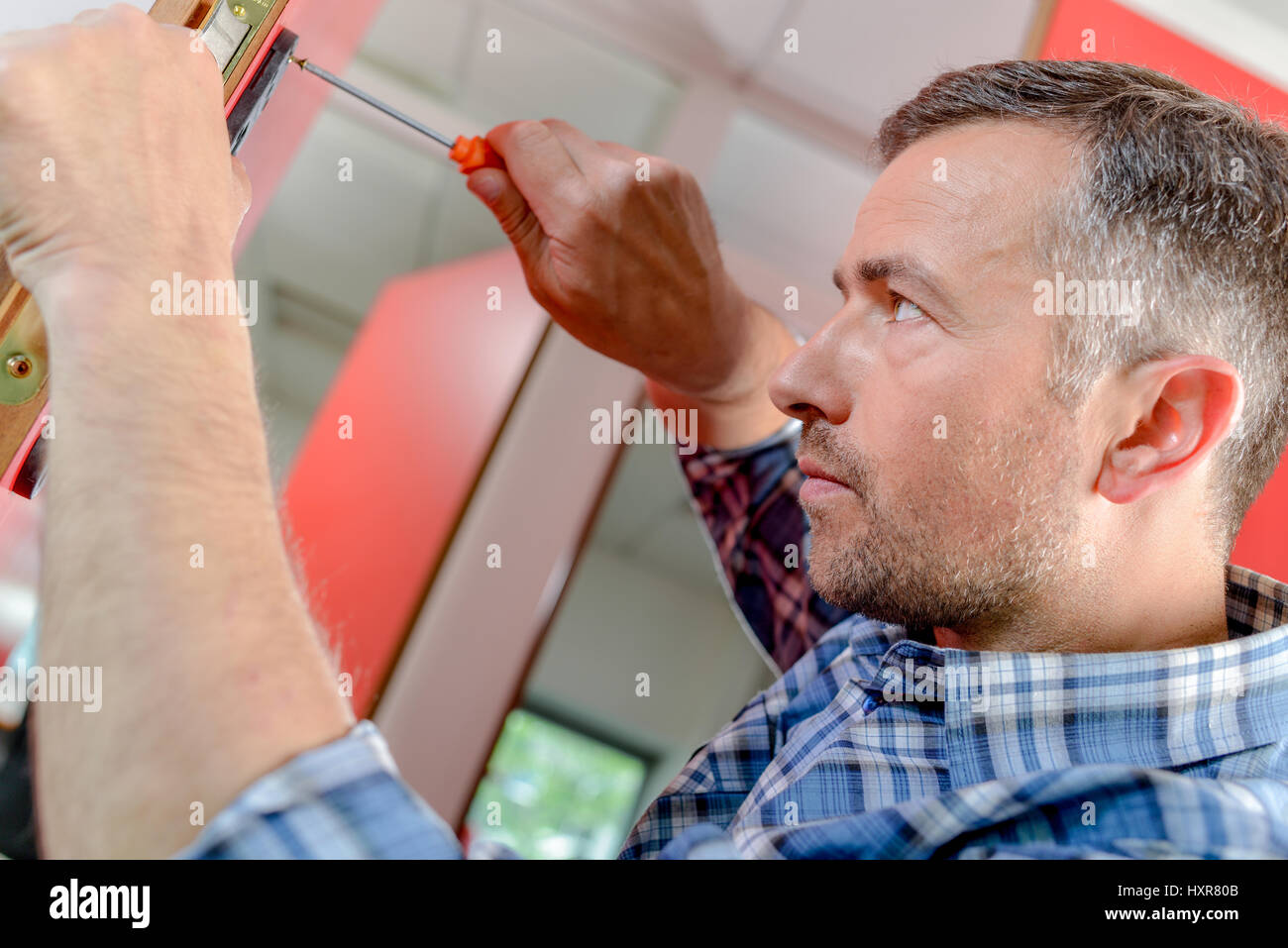 Repairing a broken door Stock Photo - Alamy