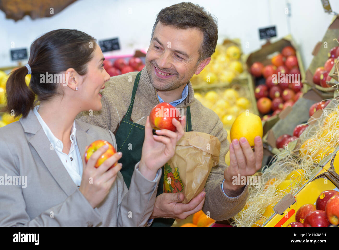 giving addition fruit Stock Photo - Alamy