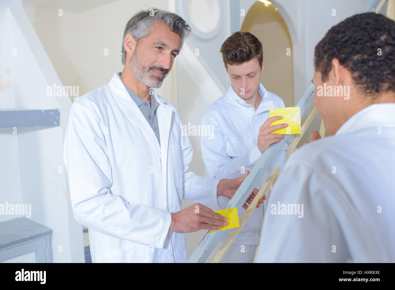 teacher with students in craft class Stock Photo - Alamy