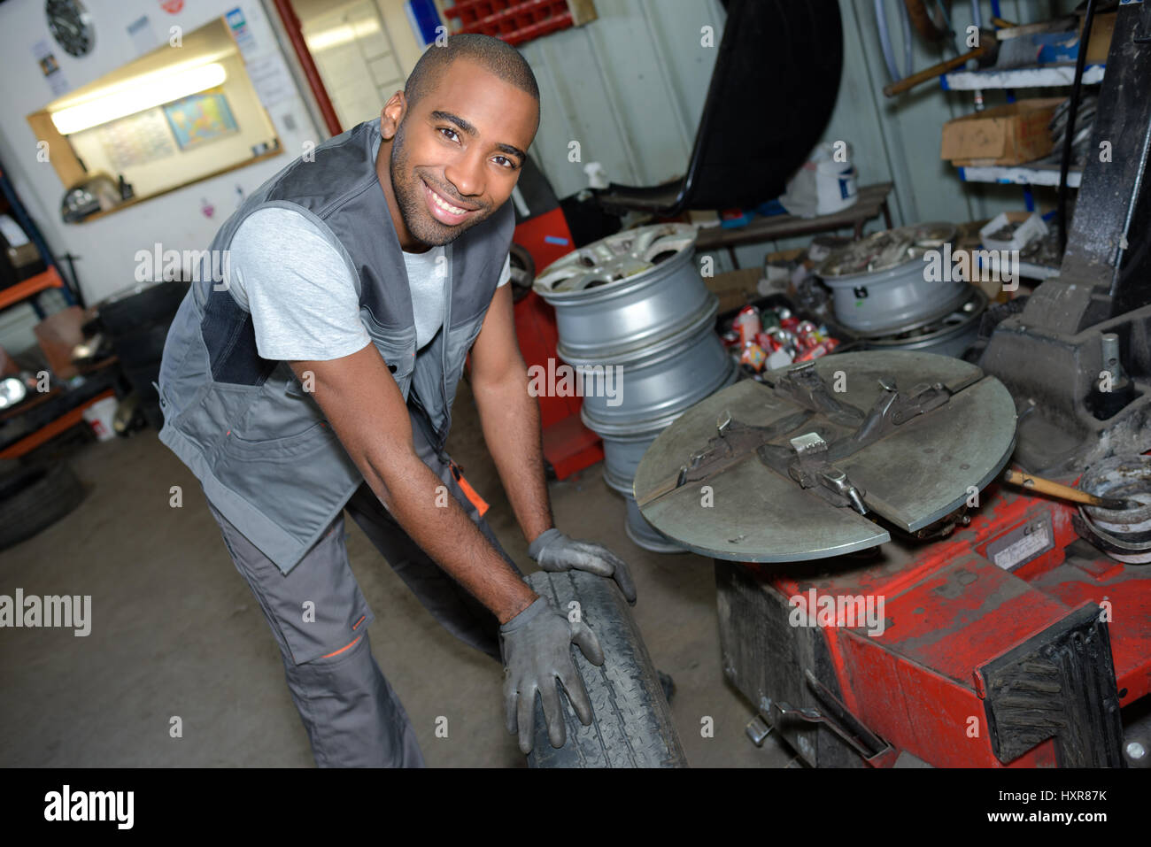 Portrait of tire fitter Stock Photo - Alamy