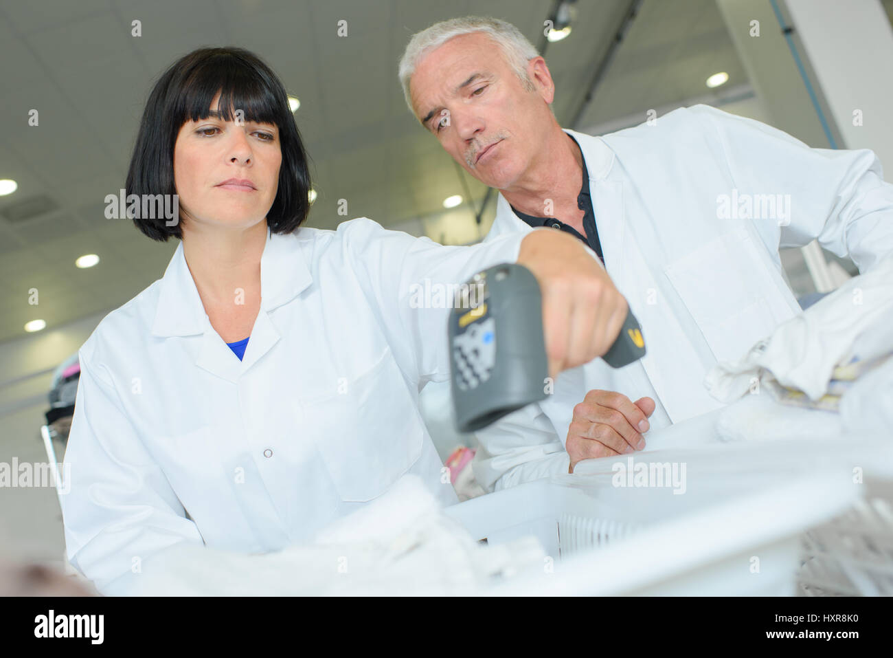 Woman scanning barcode label hi-res stock photography and images - Alamy