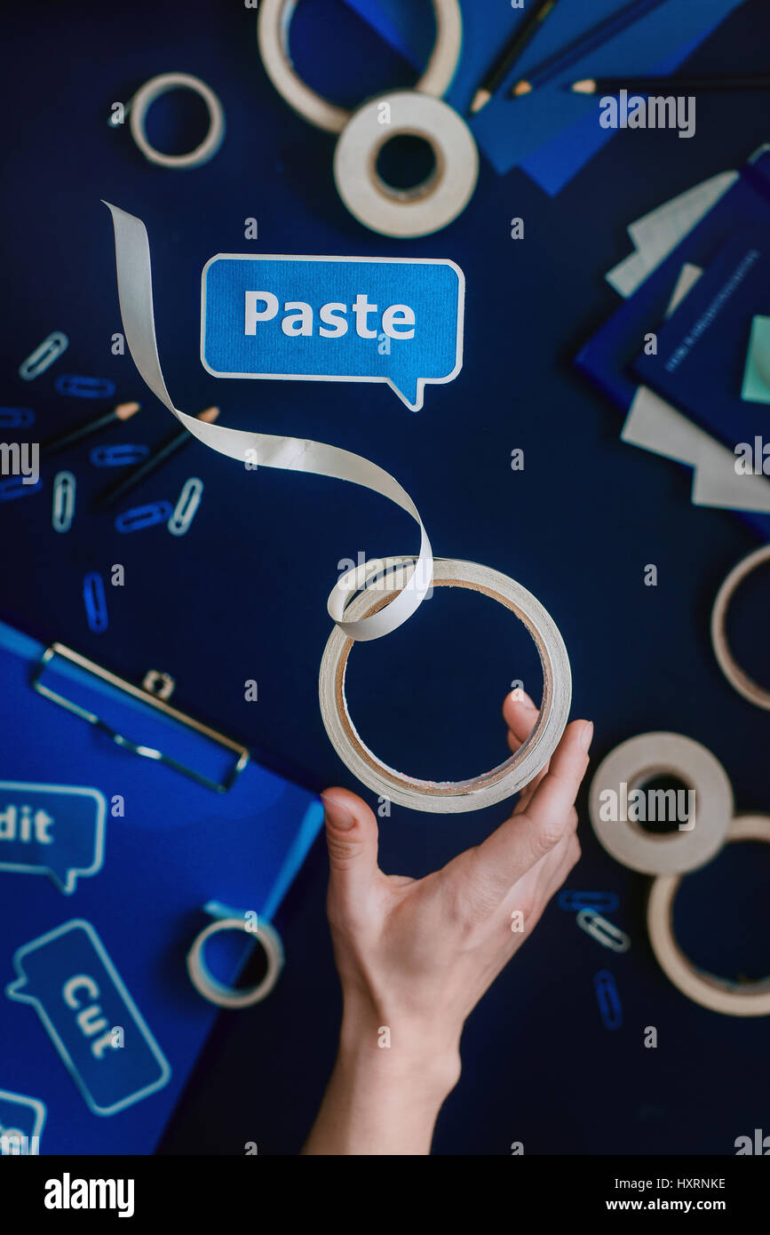 Office desk with paper context menu saying: Paste. Real life text ...