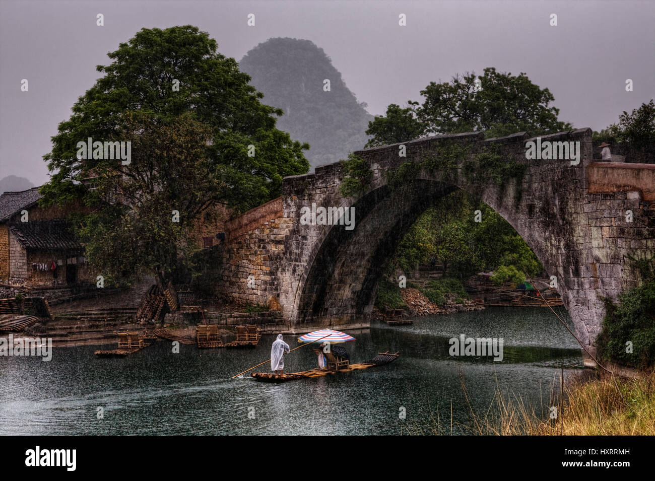 Yangshuo, Guangxi, China - March 31, 2010: Dragon Bridge in Yulong ...