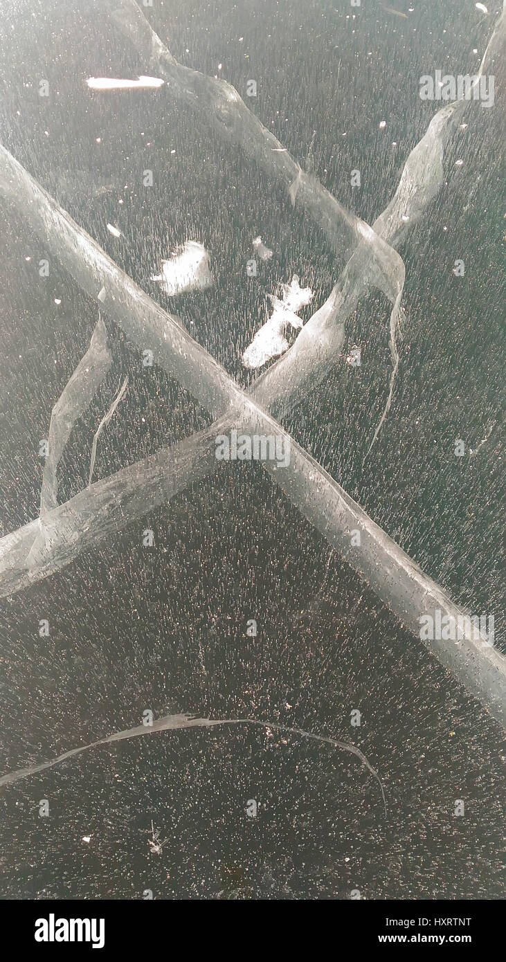 Snow Covered Ice Cracked Ground Texture Top view Stock Photo - Alamy