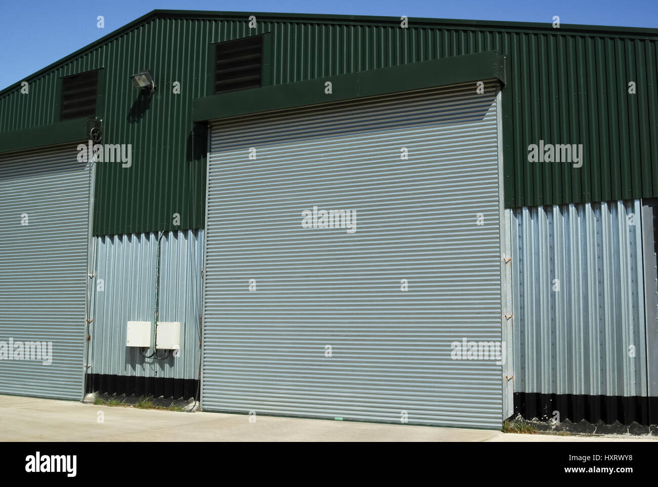 large shutter doors of a modern industrial warehouse Stock Photo - Alamy