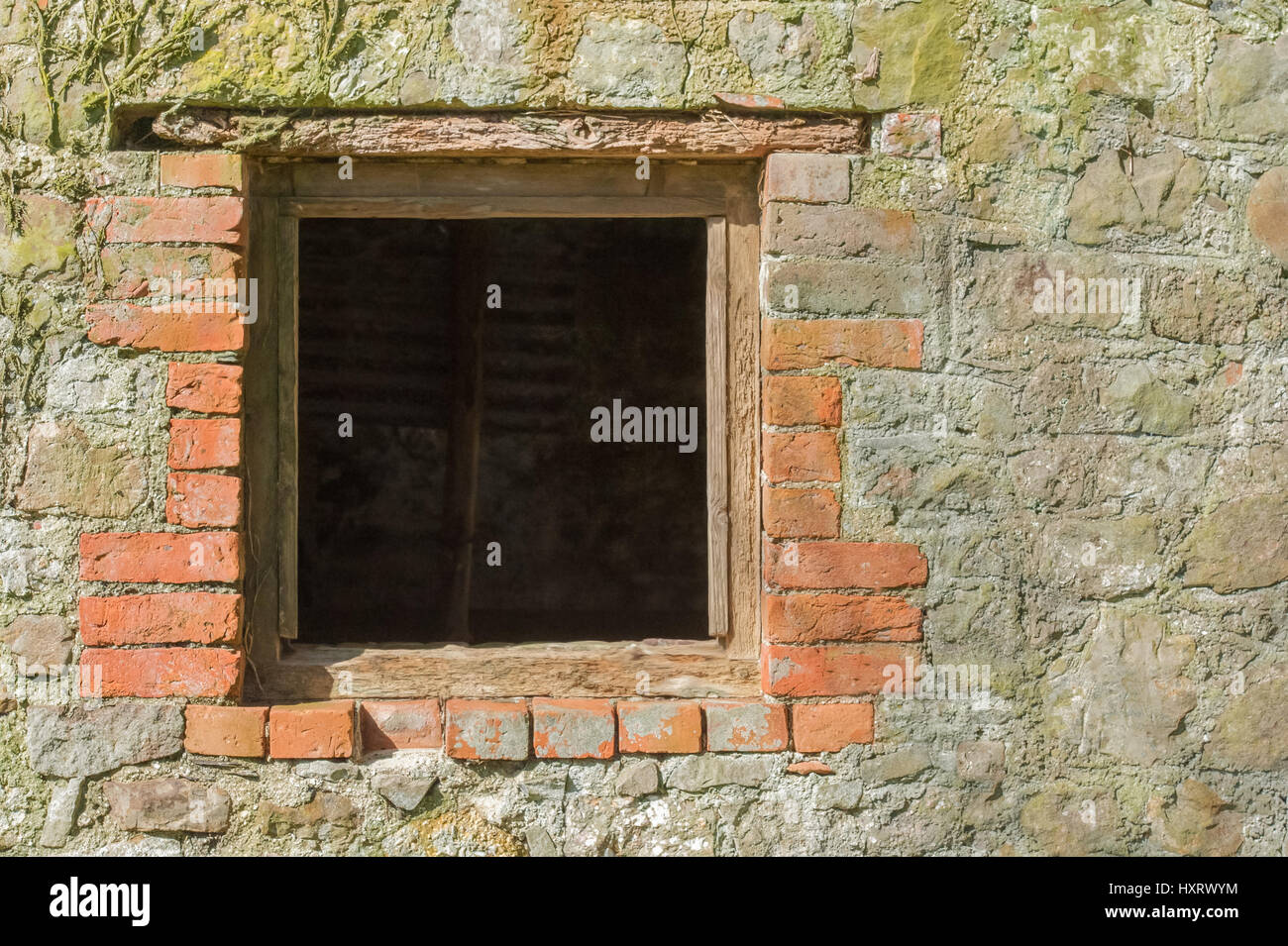 architectural background of a glassless brick surround window frame ...