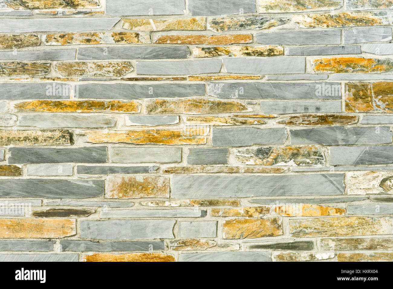 stone wall background of slate and sandstone masonry Stock Photo - Alamy