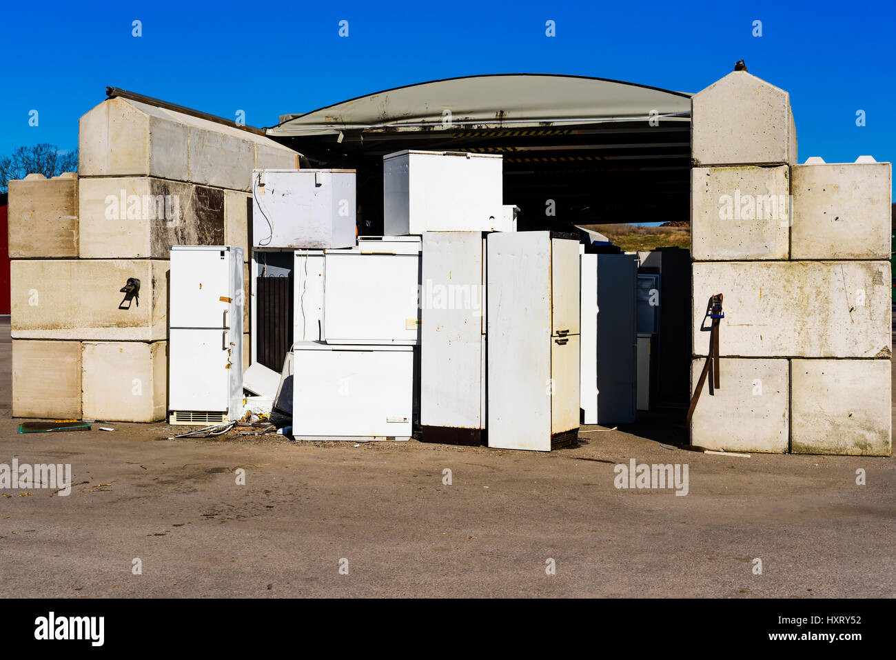 Discarded fridges and freezers at a local waste station. Here they ...