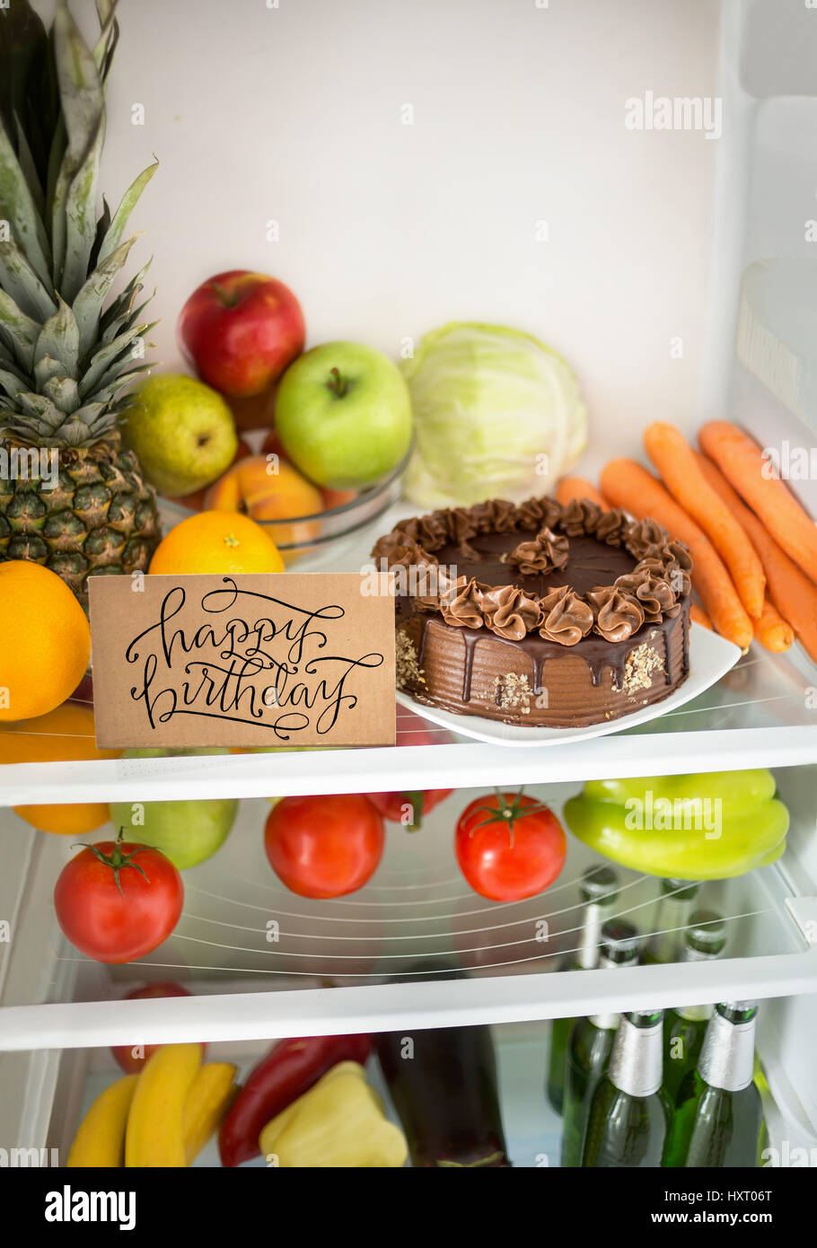 Chocolate cake for birthday surprise in fridge Stock Photo - Alamy