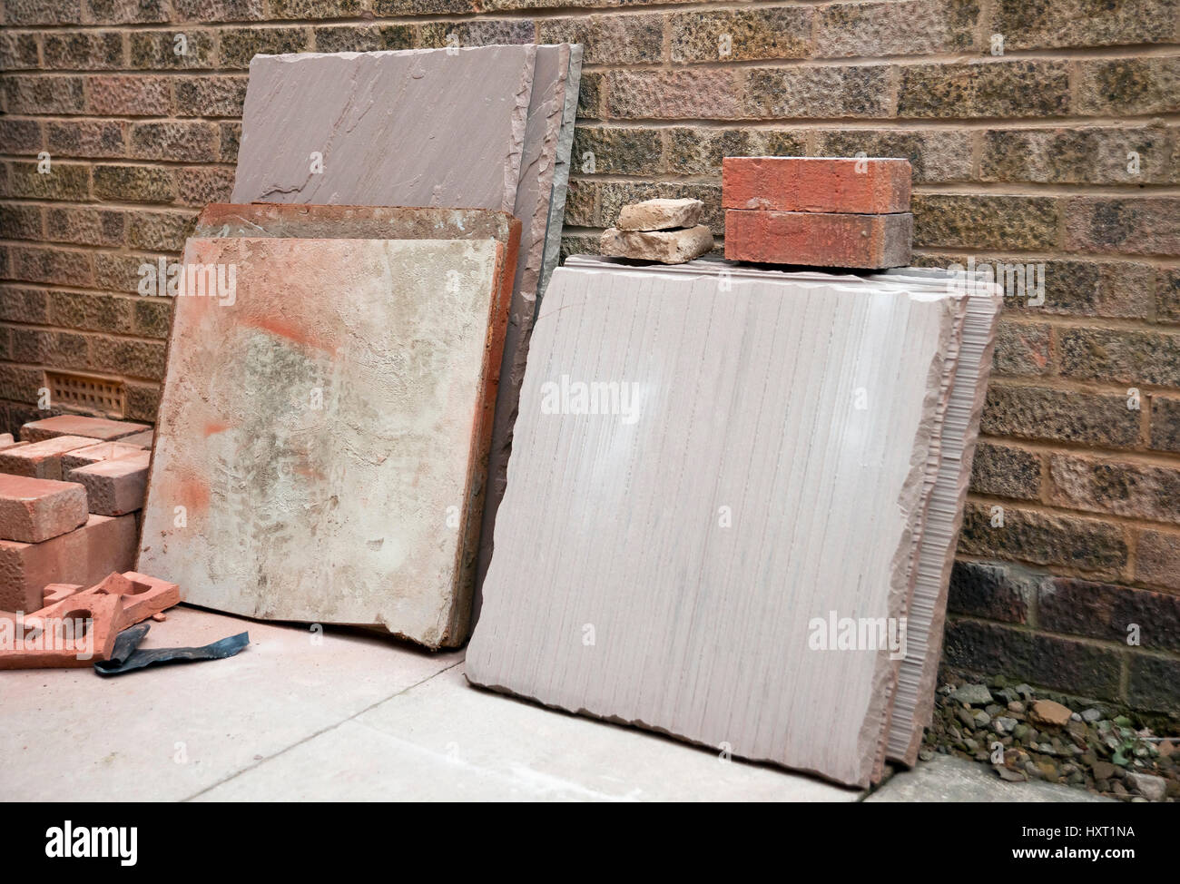 Paving slabs slab propped leaning against wall England UK United ...