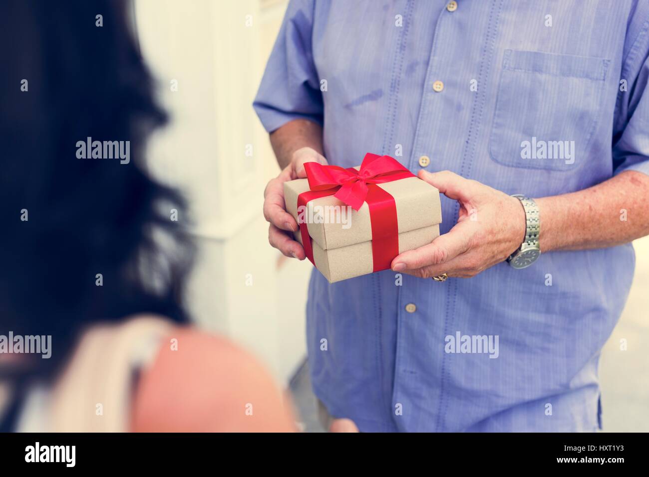 Husband giving wife box hi-res stock photography and images - Alamy