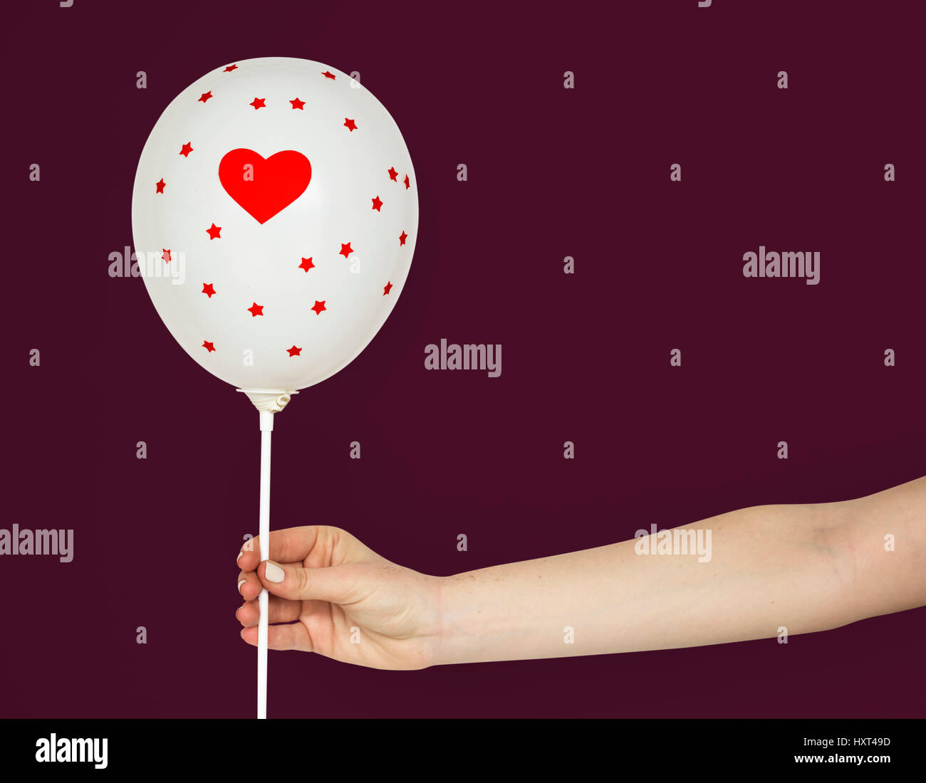 Hands Holding Balloon Heart Decoration Stock Photo - Alamy