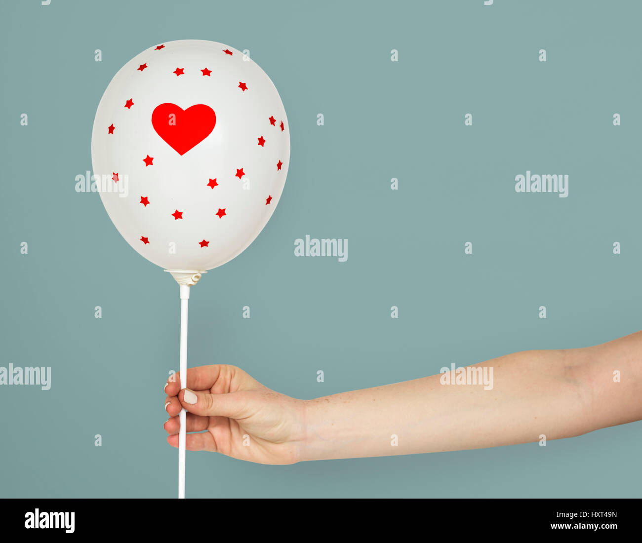 Hands holding balloon hi-res stock photography and images - Alamy