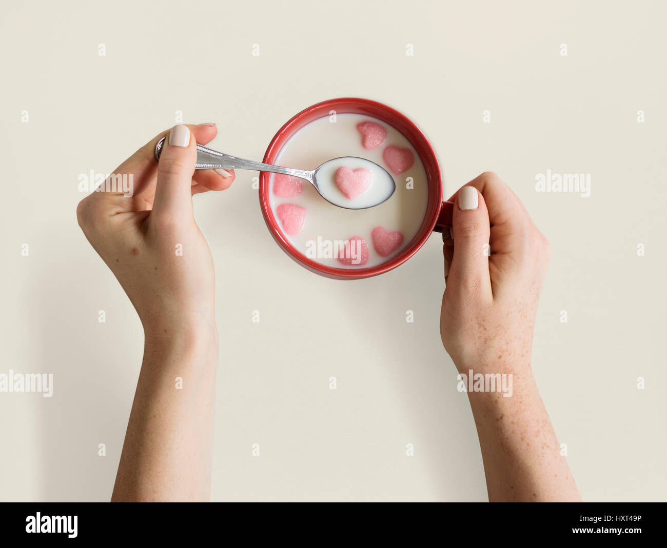 Hands Eating Cereal Heart Shaped Stock Photo - Alamy