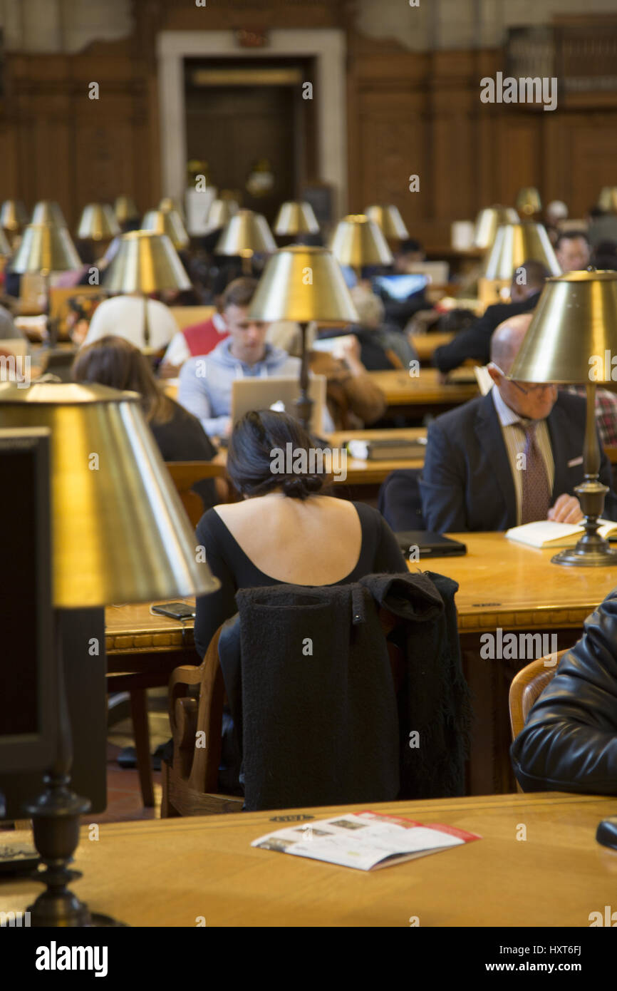 People use the large iconic south reading room at the New York Public ...