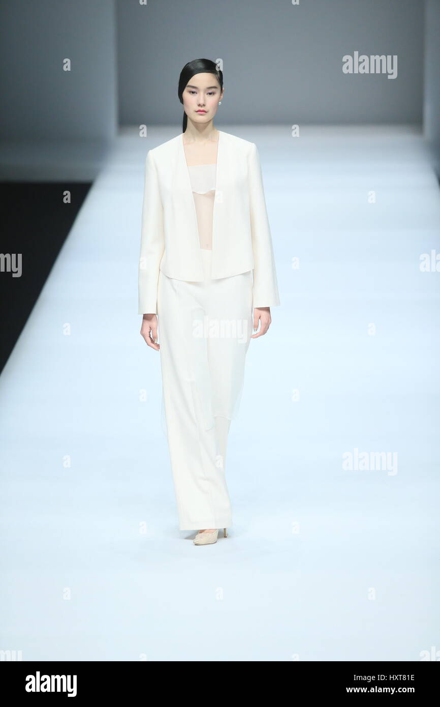 Beijing, Beijing, China. 29th Mar, 2017. A model presents a creation of ...