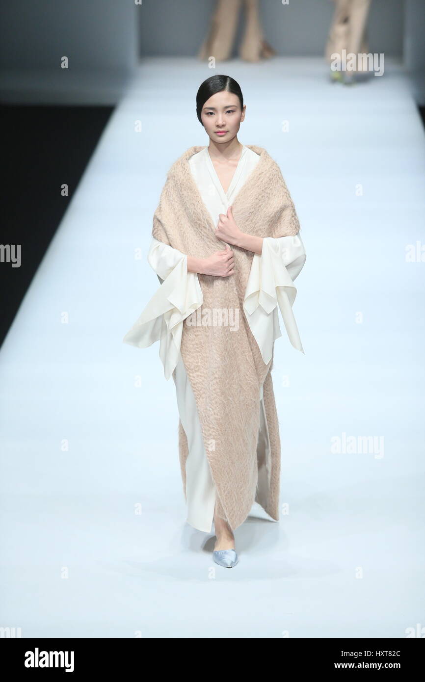 Beijing, Beijing, China. 29th Mar, 2017. A model presents a creation of ...