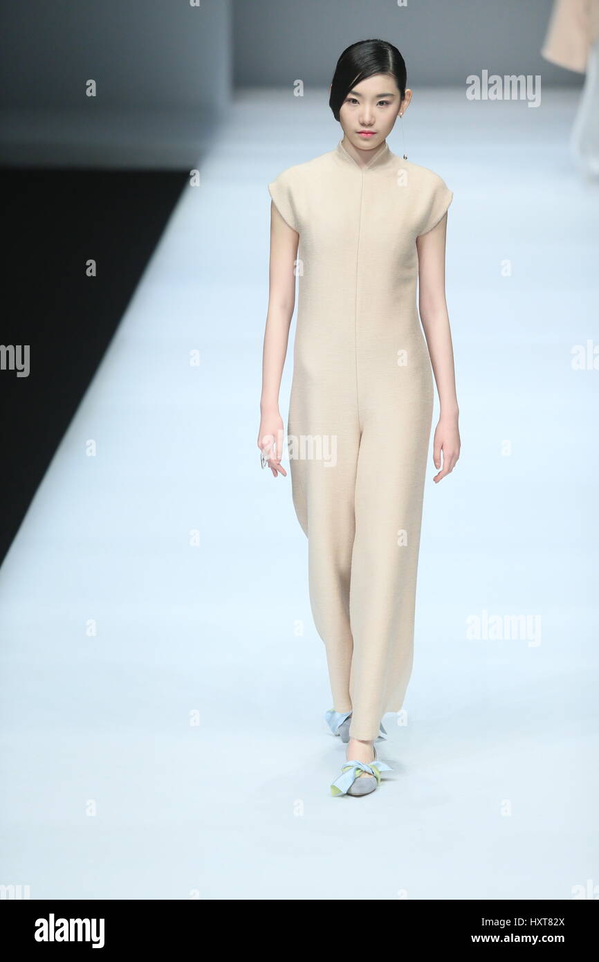 Beijing, Beijing, China. 29th Mar, 2017. A model presents a creation of ...
