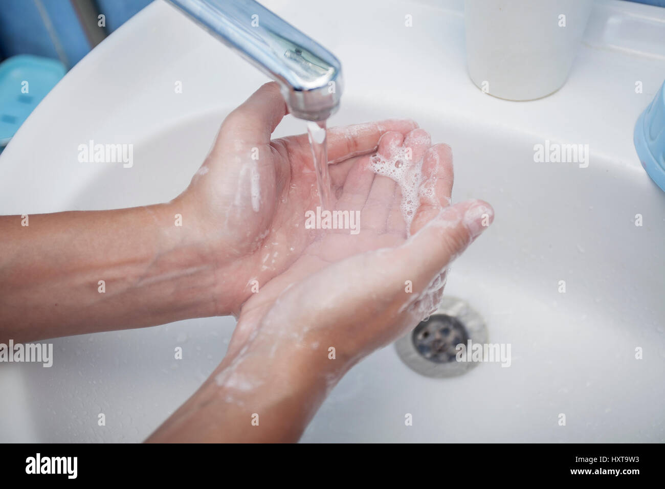 We wash hands with soap under a water stream Stock Photo - Alamy