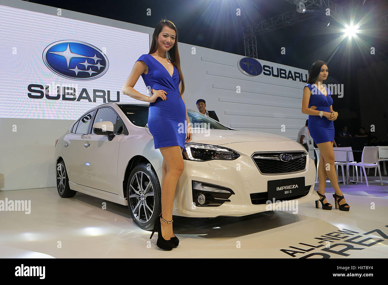 Pasay City, Philippines. 30th Mar, 2017. Models pose beside a Subaru ...