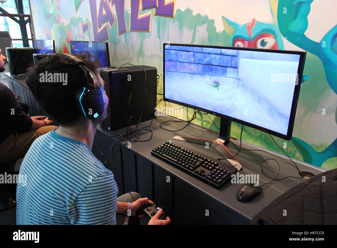 Gamers text out the latest technology at EGX Rezzed, London 2017 Stock ...