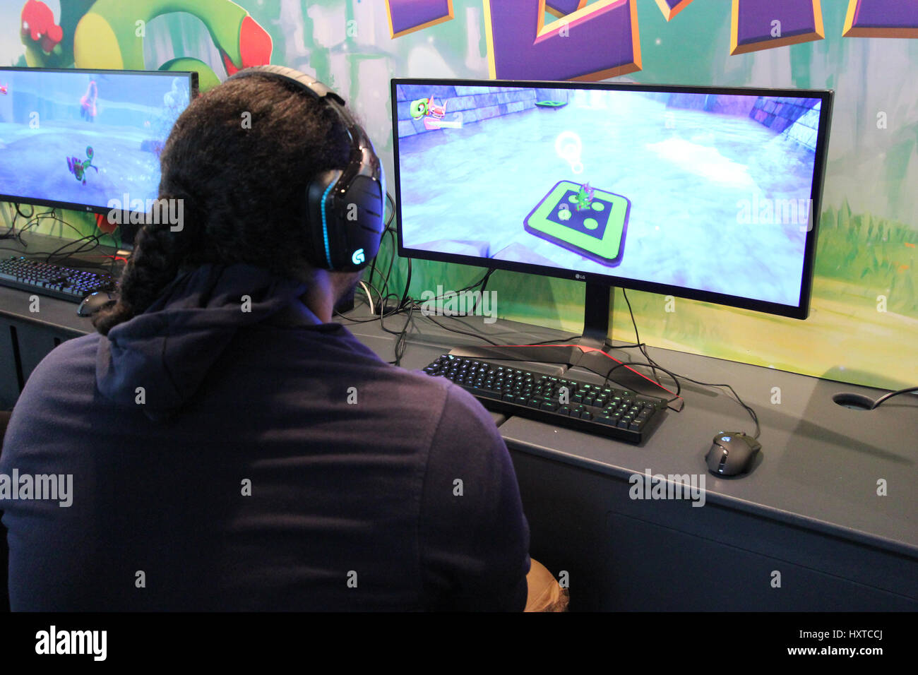 Gamers text out the latest technology at EGX Rezzed, London 2017 Stock ...