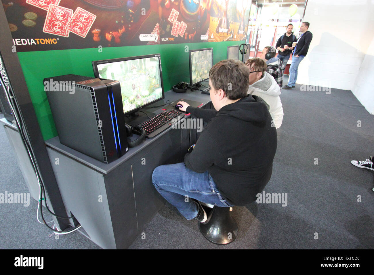 Gamers text out the latest technology at EGX Rezzed, London 2017 Stock ...