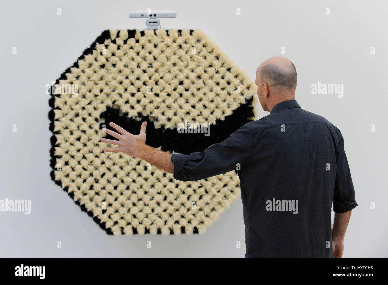 London, UK. 30th Mar, 2017. Artist Daniel Rozin interacts with his work ...