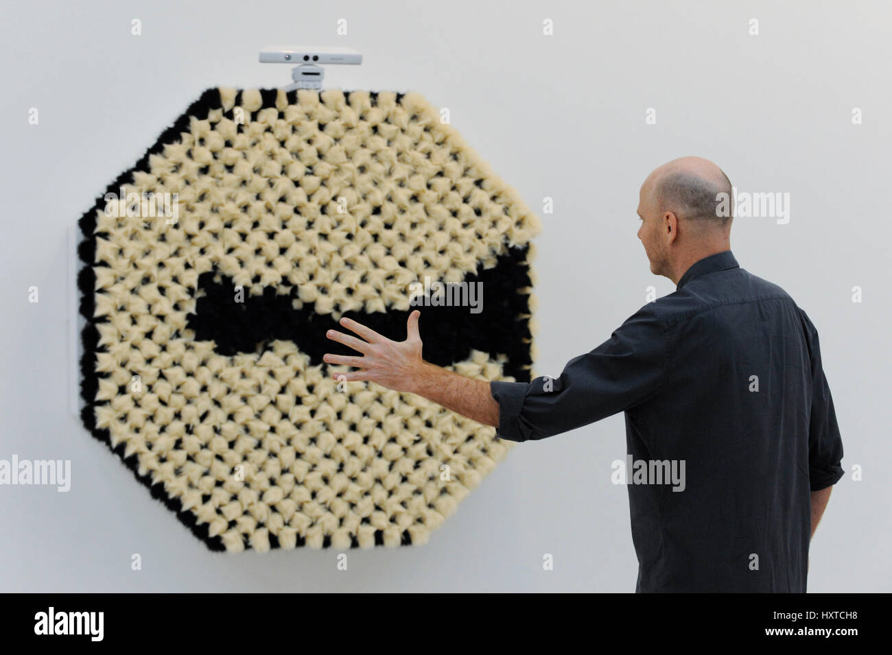 London, UK. 30th Mar, 2017. Artist Daniel Rozin interacts with his work ...
