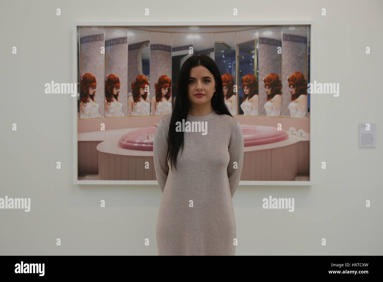 London, UK. 30th Mar, 2017. Juno Calypso in front of her self-portrait ...