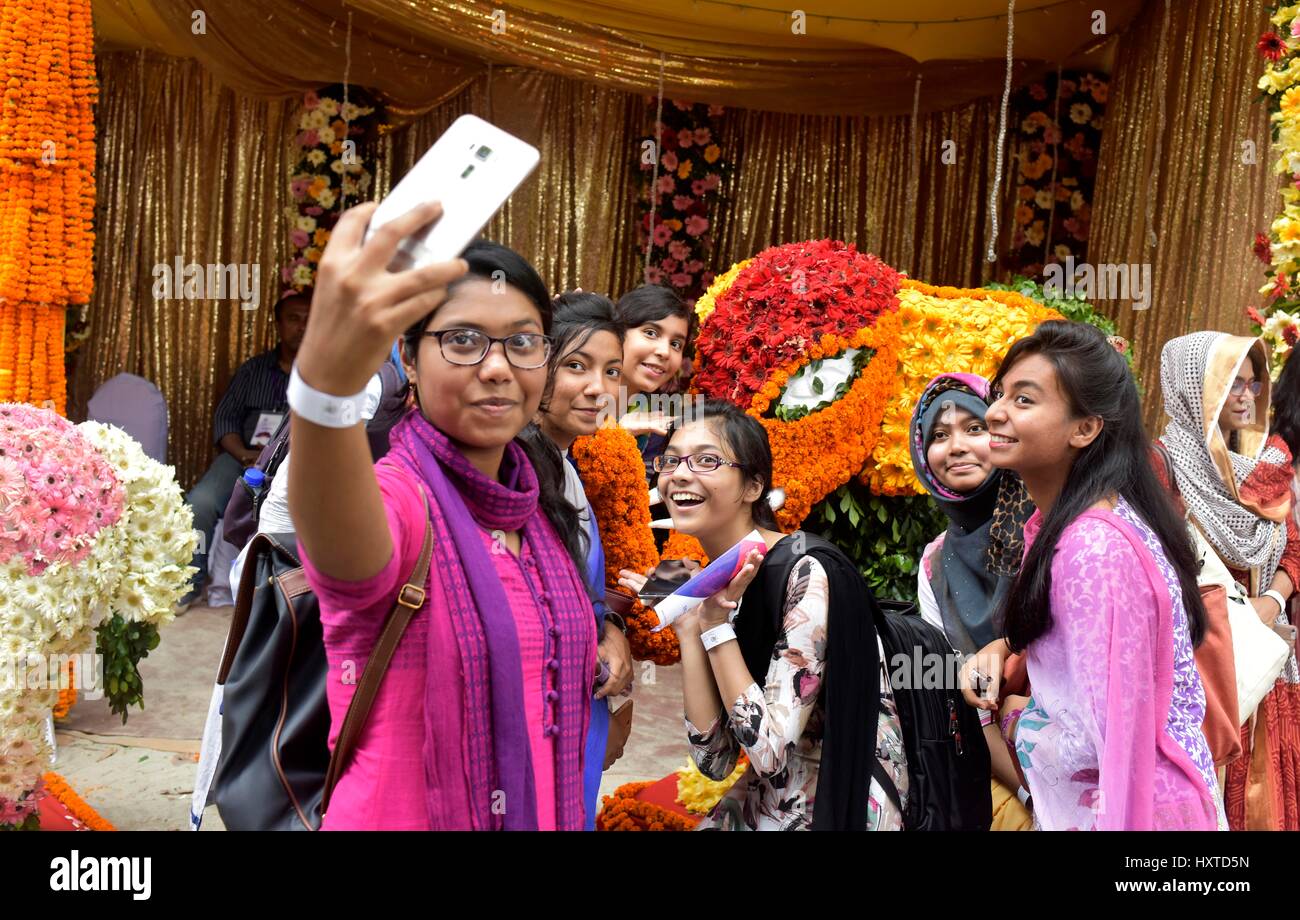 Dhaka, Bangladesh. 30th Mar, 2017. Bangladeshi girls takes photo as they visits Second Flower ...