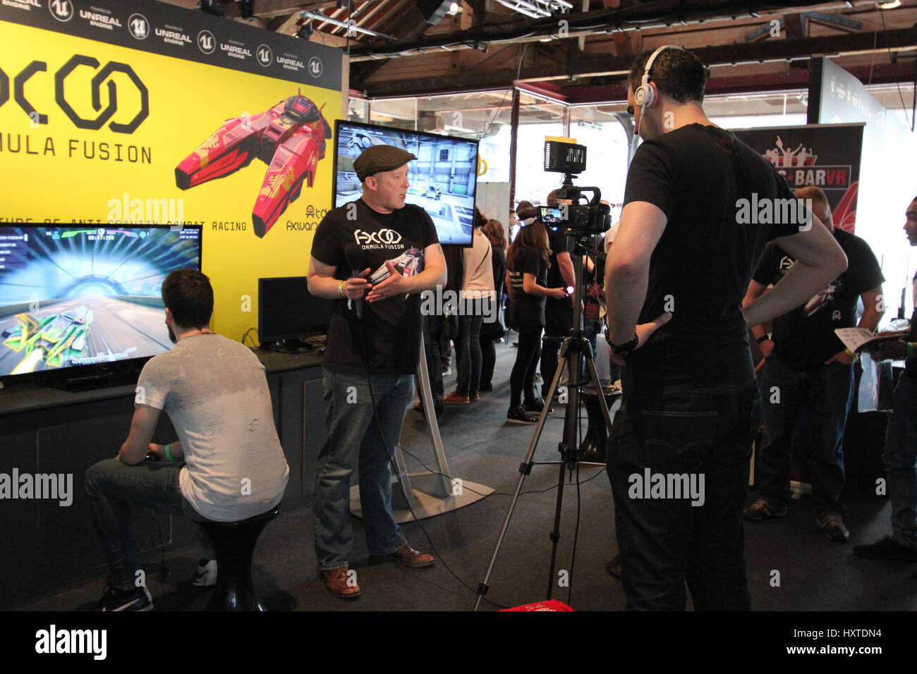 Gamers text out the latest technology at EGX Rezzed, London 2017 Stock ...