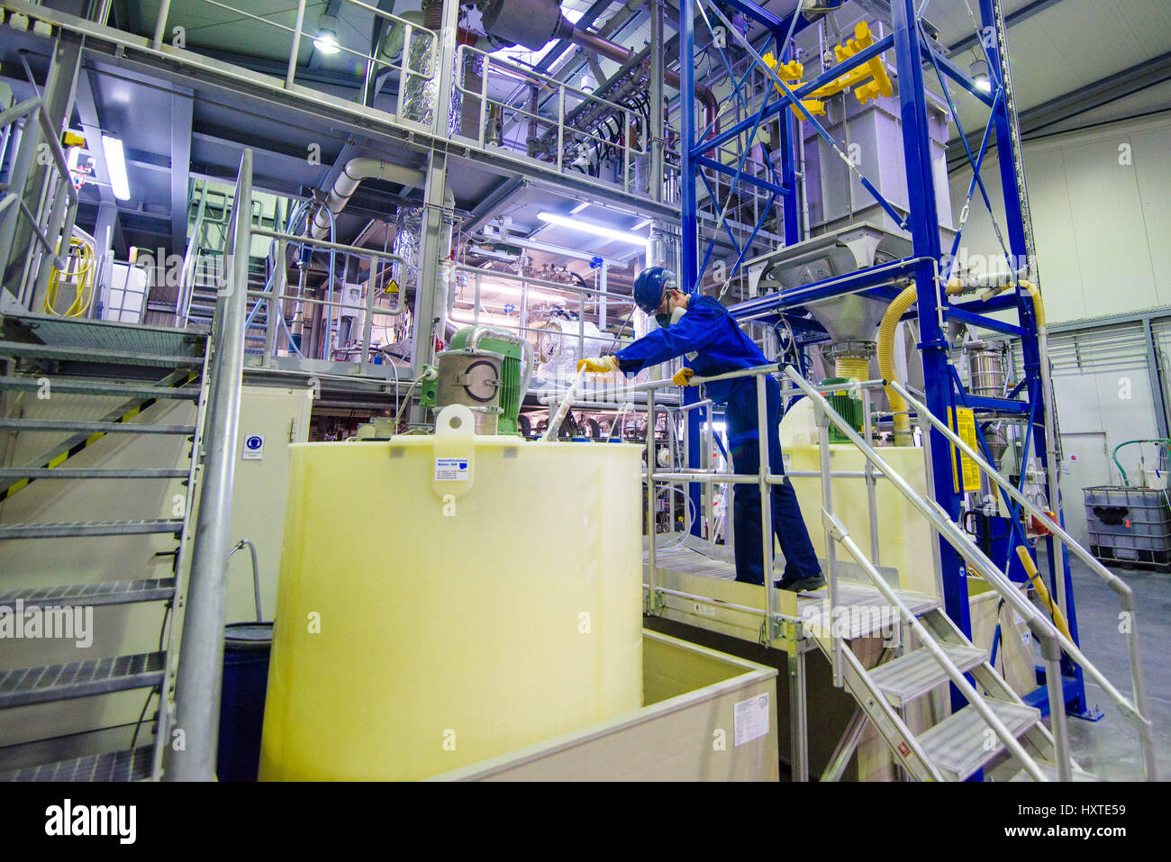 Weimar, Germany. 30th Mar, 2017. An employee inspects a container of the pulsation reactor in a ...