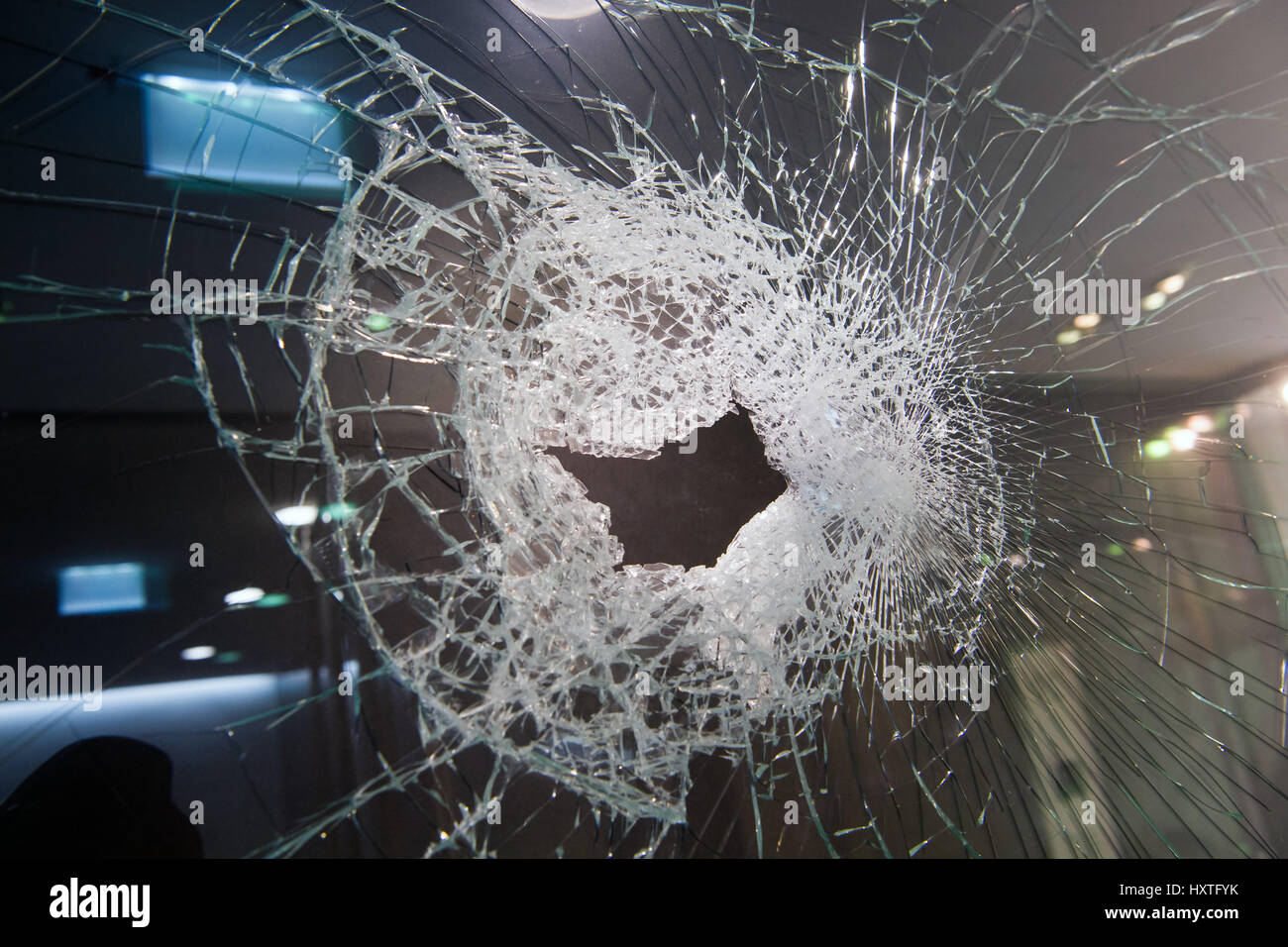 Munich, Germany. 28th Mar, 2017. A damaged shop window in Munich ...