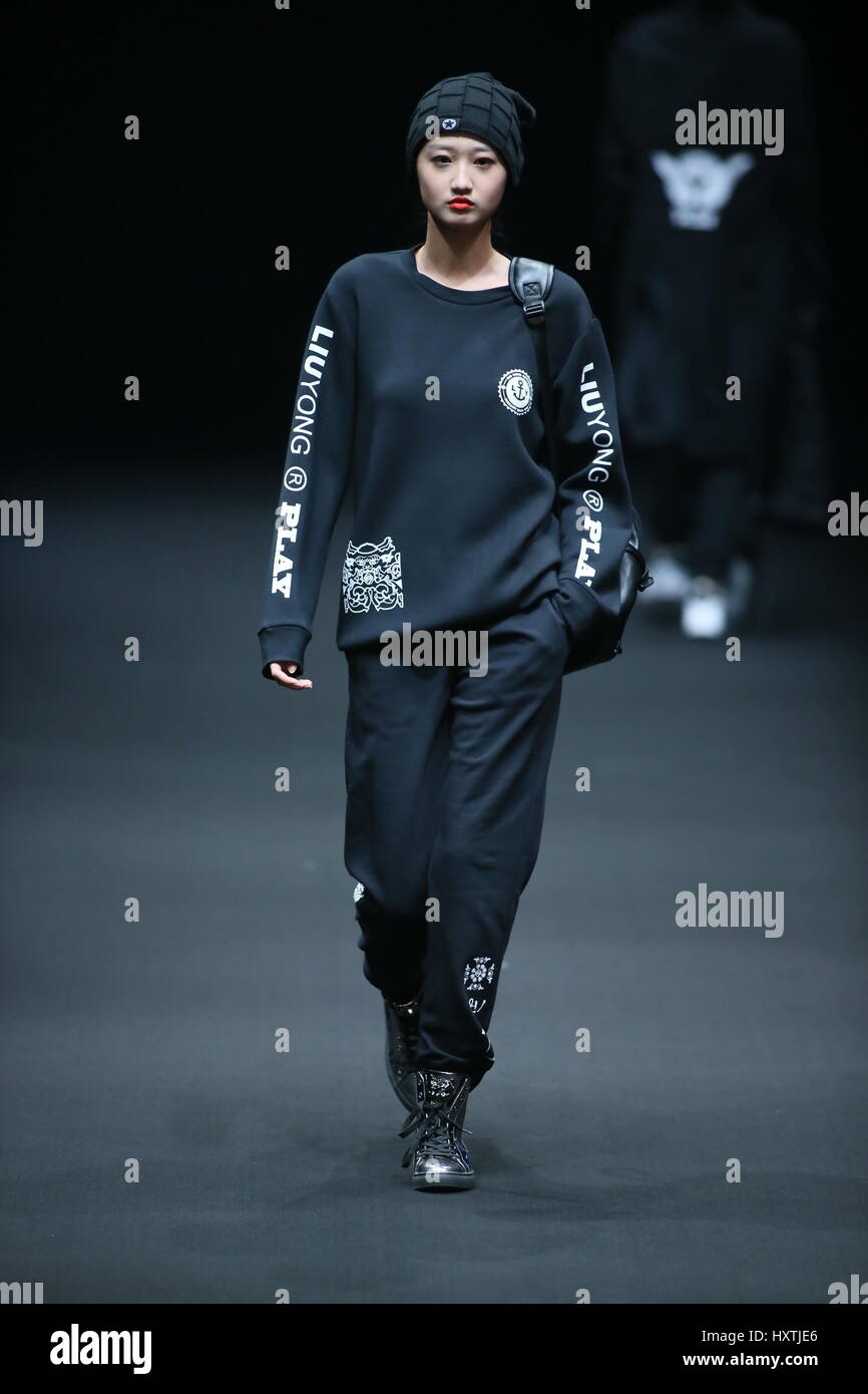 Beijing, Beijing, China. 30th Mar, 2017. A model presents a creation of ...