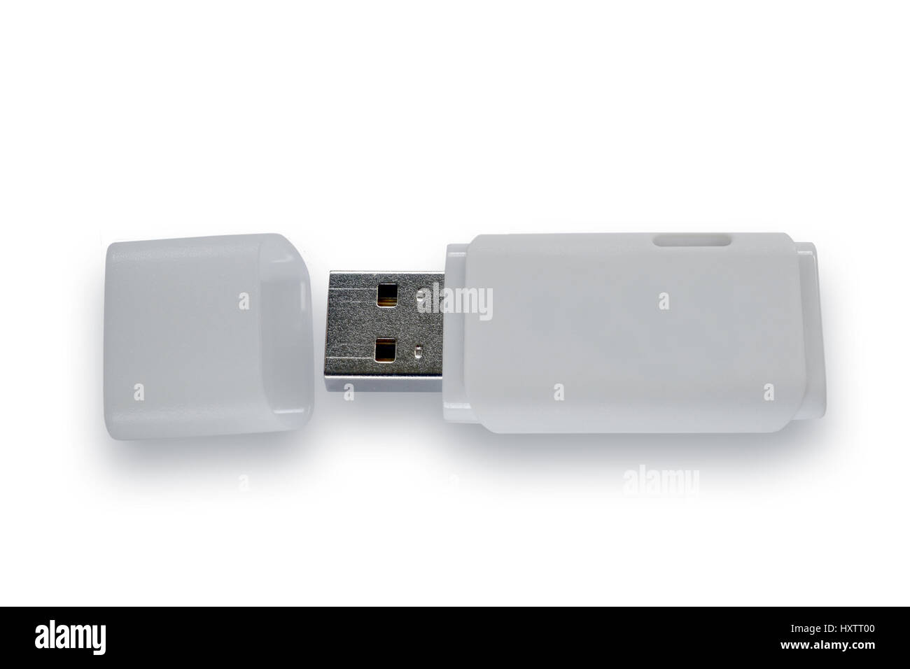 A white USB memory stick with its back up, on a white background with ...
