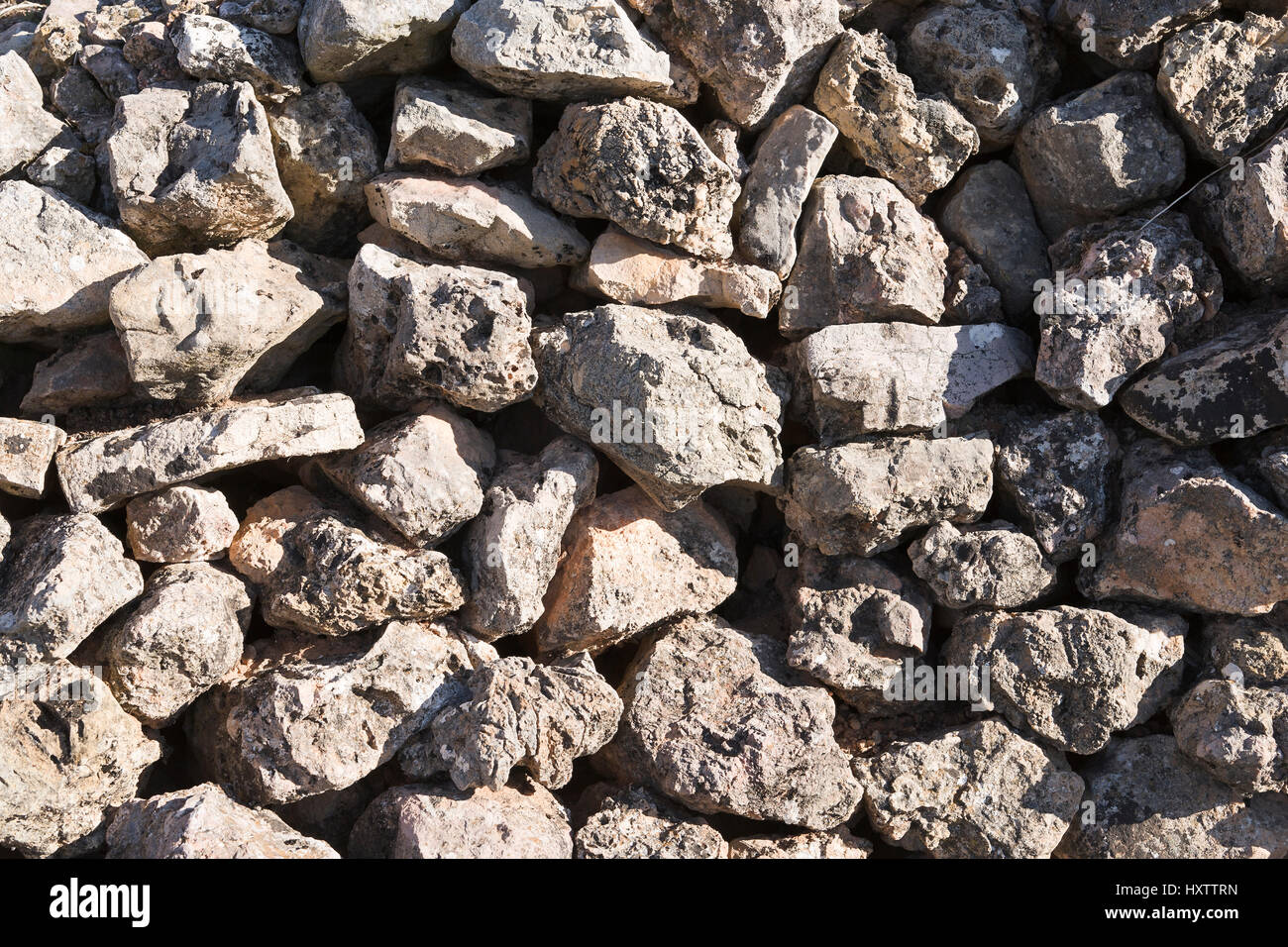 Stone wall with very sharp shadows. Horizontal shot Stock Photo - Alamy
