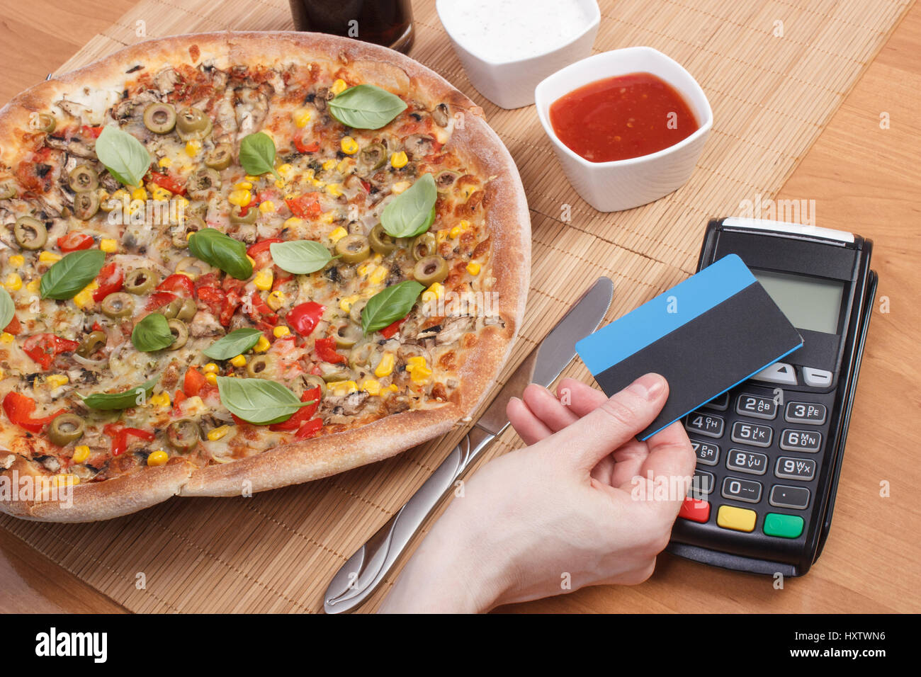 Using payment terminal with contactless credit card, cashless paying ...