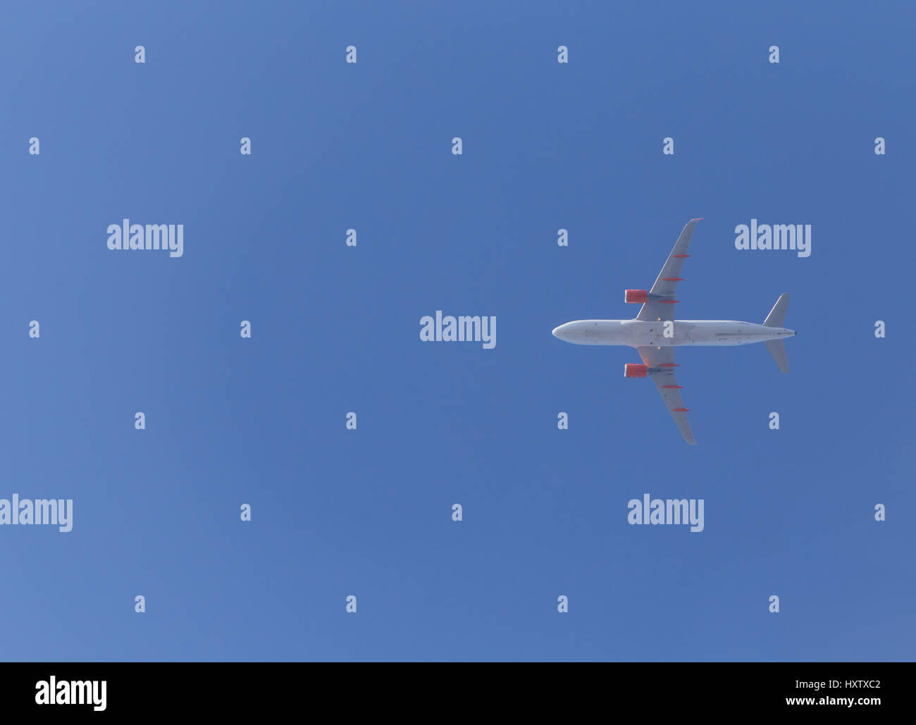 aircraft Airbus A320 flying in a blue sky Stock Photo - Alamy