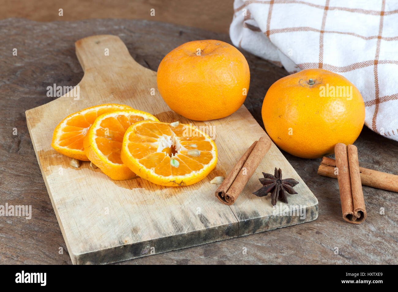 Ripe oranges sliced on oid wood background. Orange in a cut Stock Photo ...