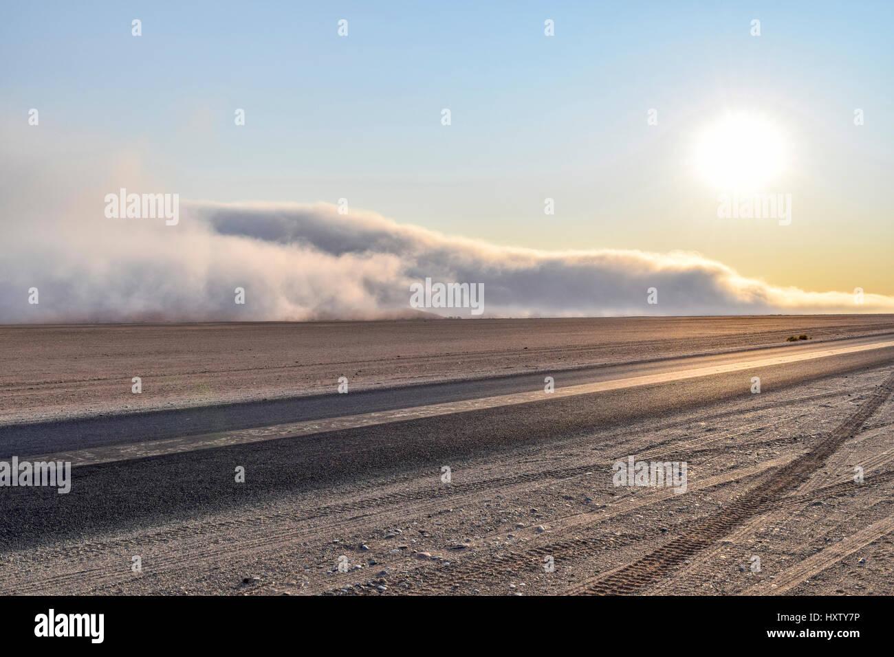Long dusty road in desert hi-res stock photography and images - Alamy